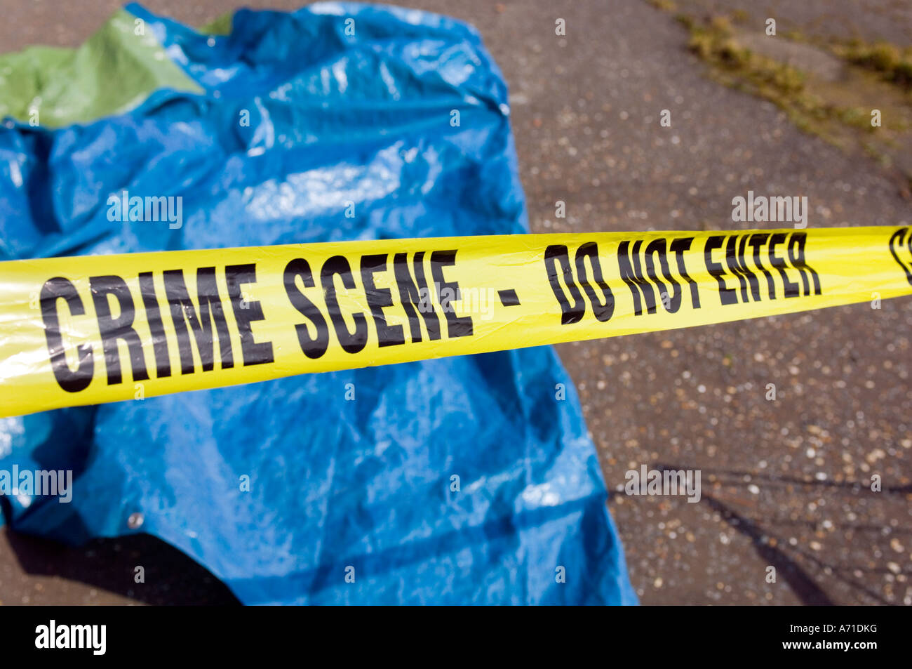 yellow police tape cordoning off a crime scene Stock Photo - Alamy
