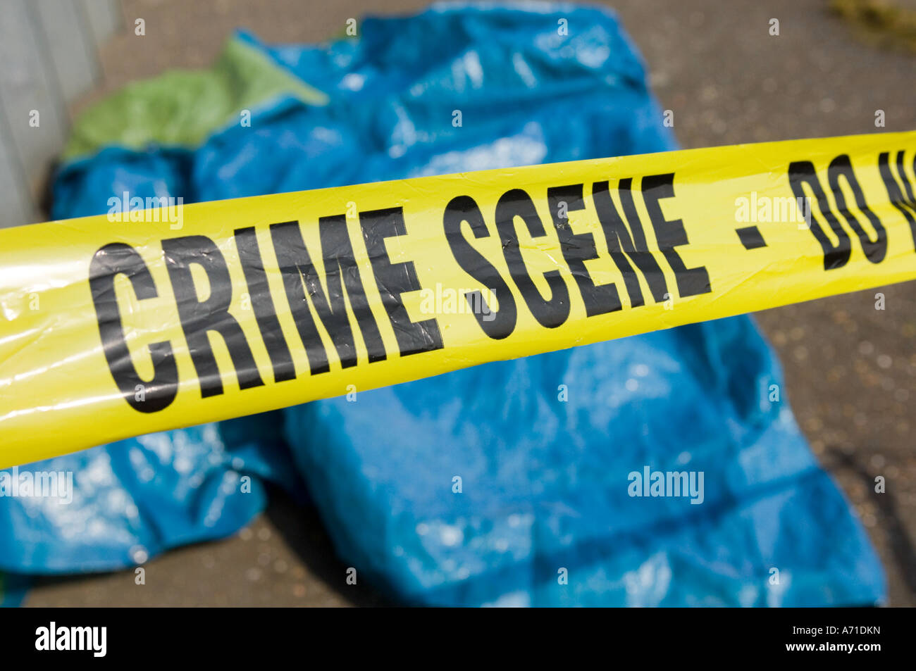 yellow police tape cordoning off a crime scene Stock Photo - Alamy