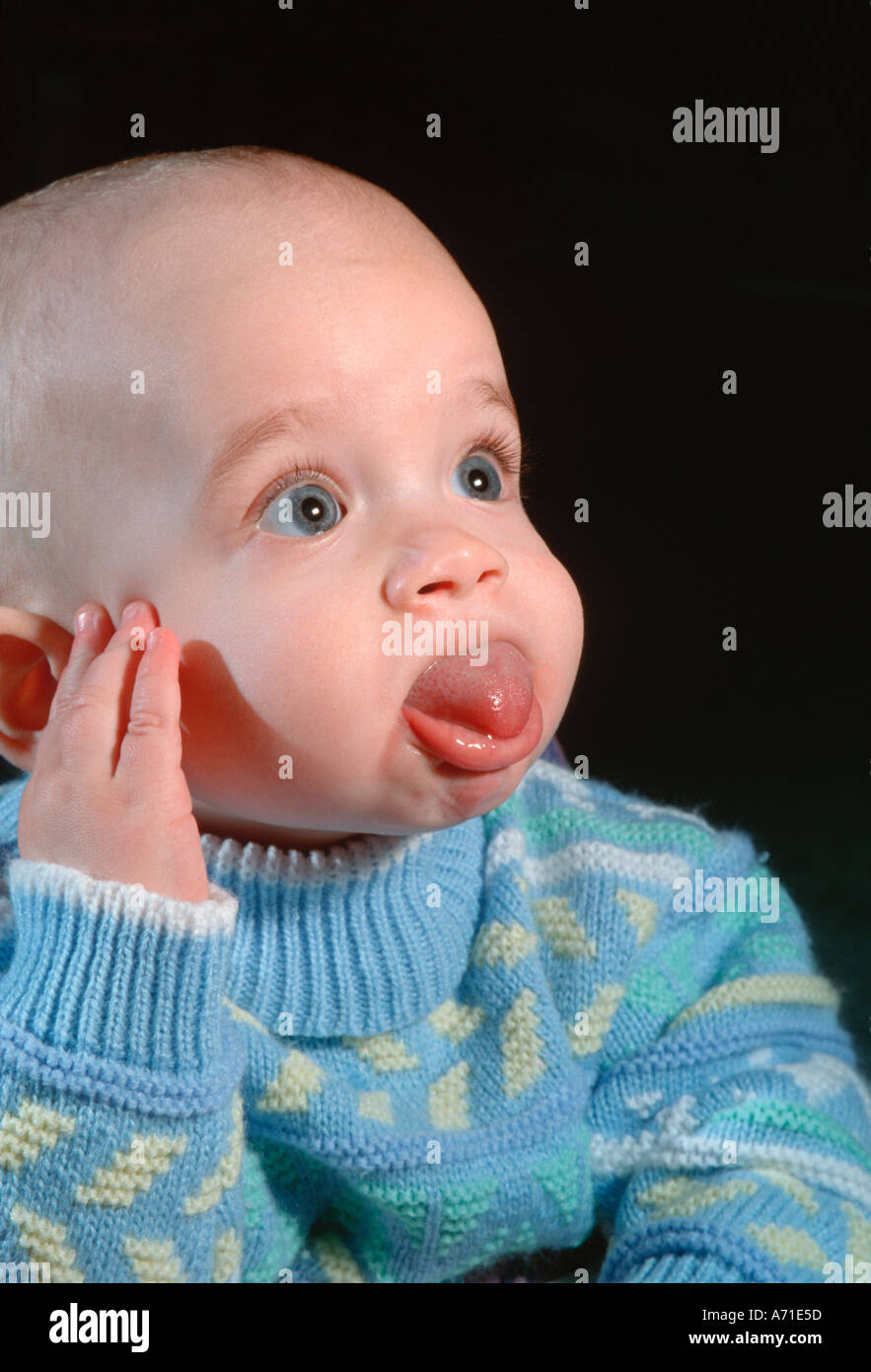 The expressions of a young baby boy Stock Photo - Alamy