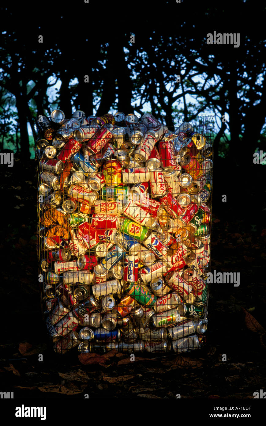 Wire frame outdoor trash container filled with aluminum cans for ...