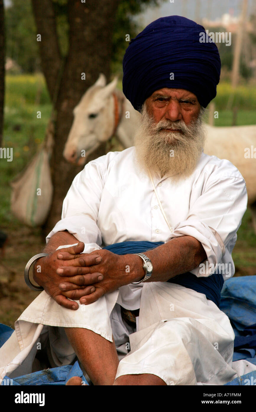 Nihang sitting at his base smiling during Baisakhi festival in Anand ...