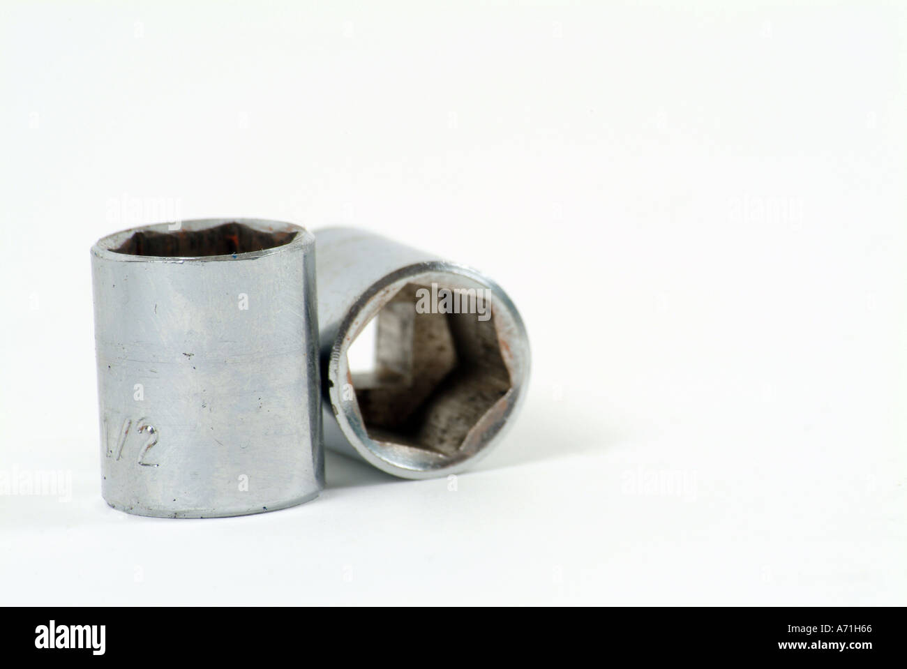 two shiny metal sockets on a white background Stock Photo - Alamy