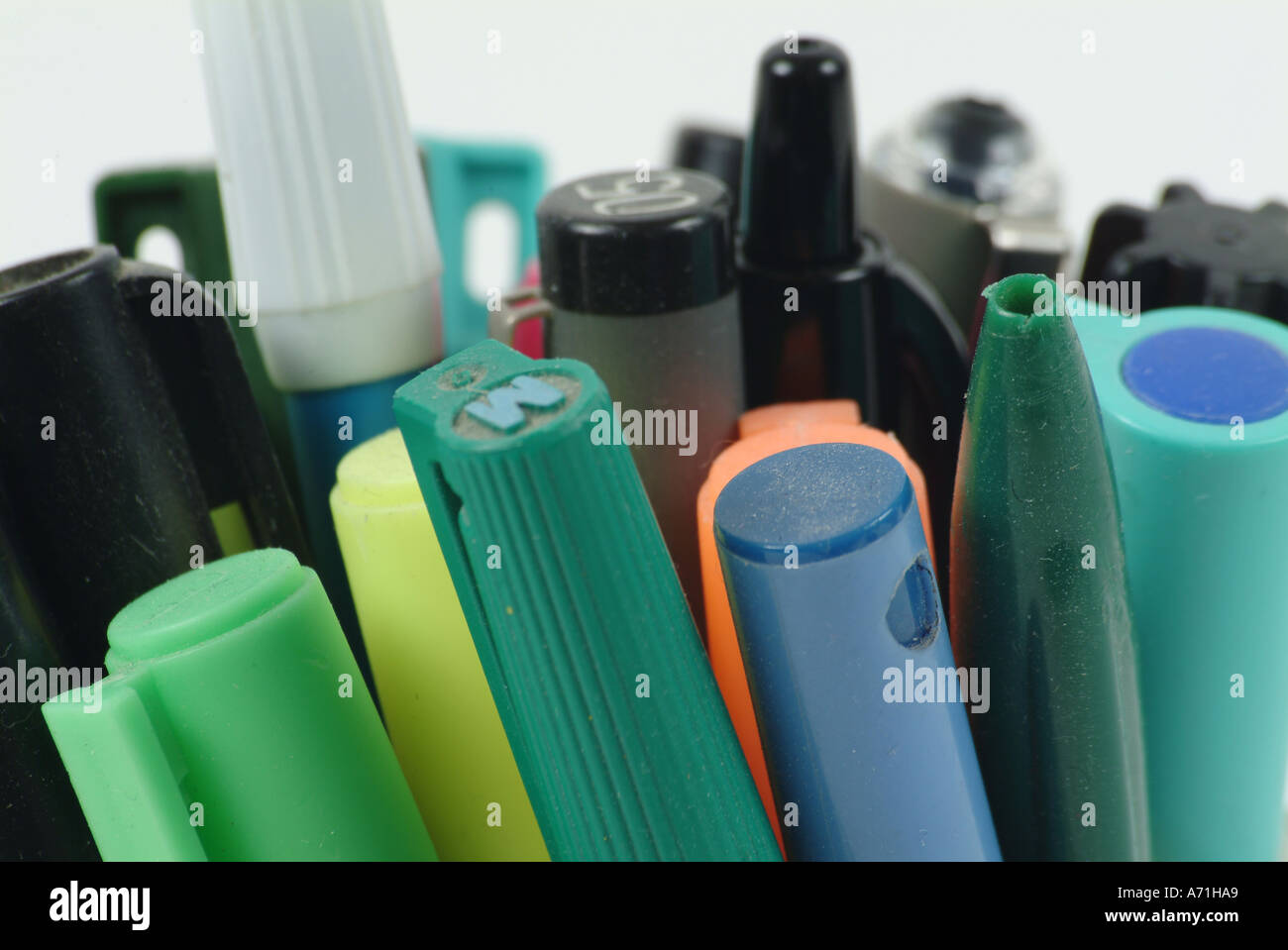 Collection of pens and markers in a clear glass jar Stock Photo - Alamy