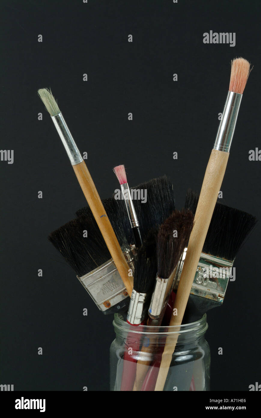 Collection of used artisits or decorators brushes in a jam jar Stock ...