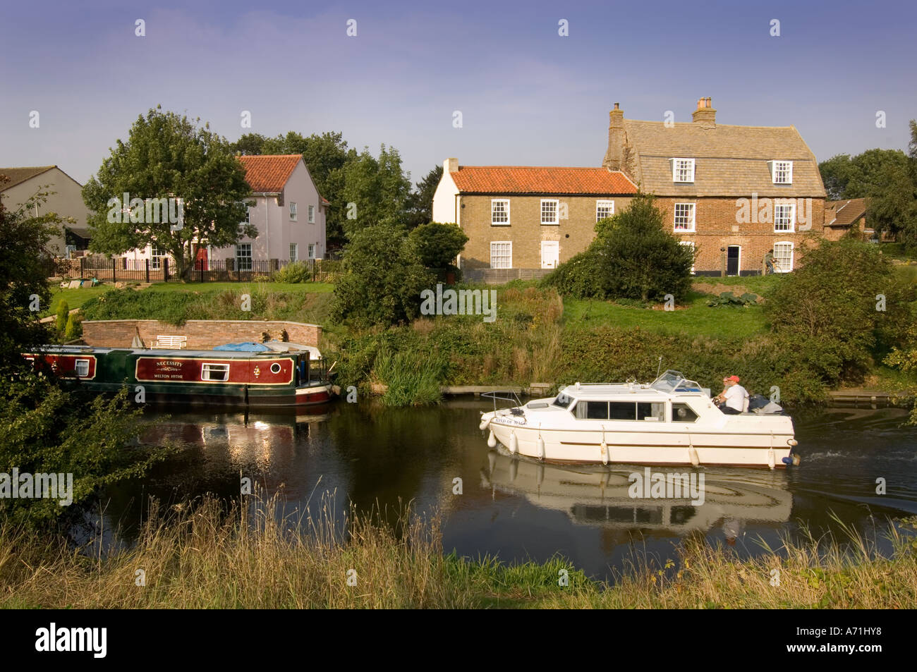 Boating along the Old River Nene in March Cambridgeshire England UK ...