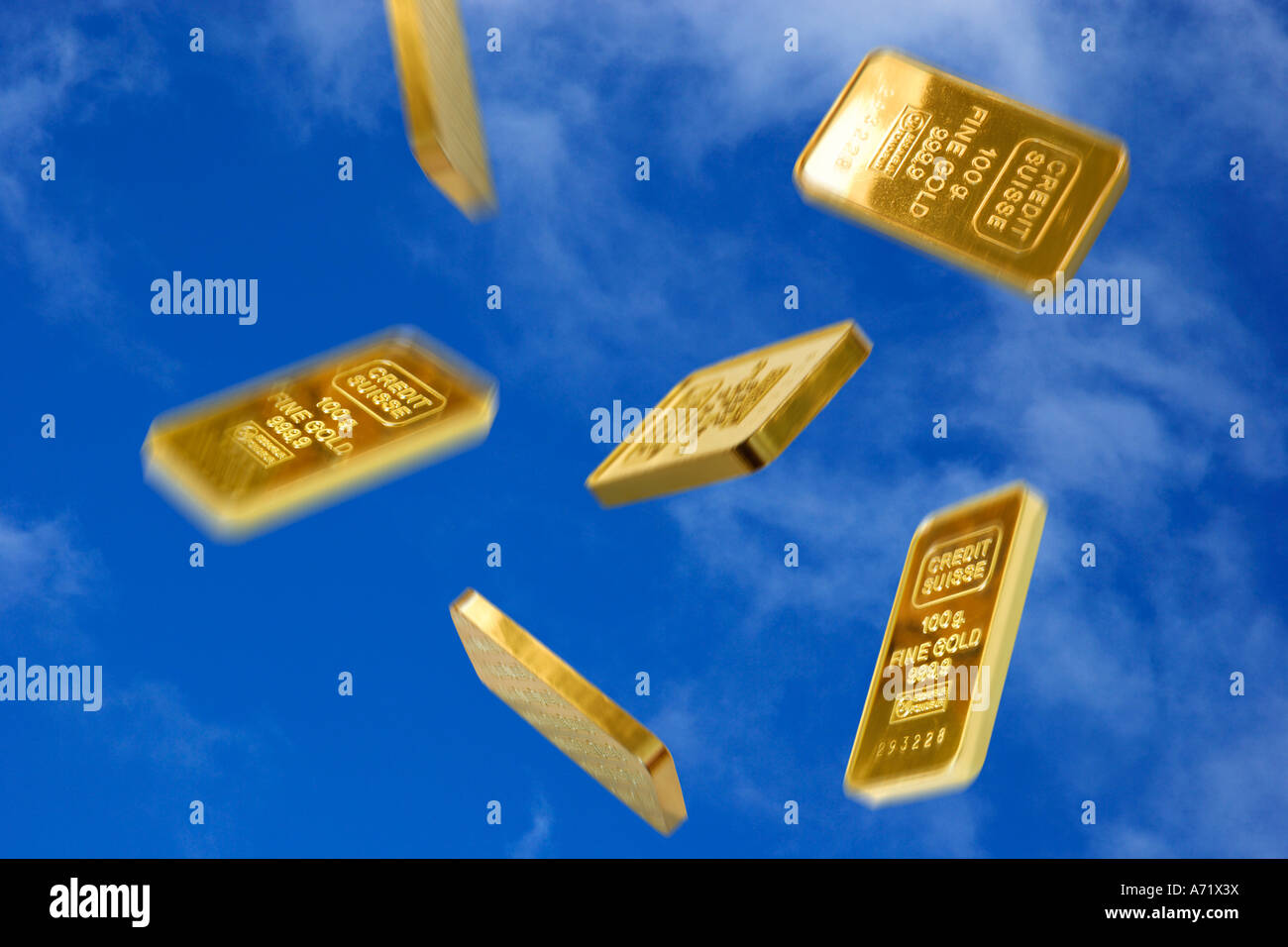 Gold bars falling from the sky Stock Photo - Alamy