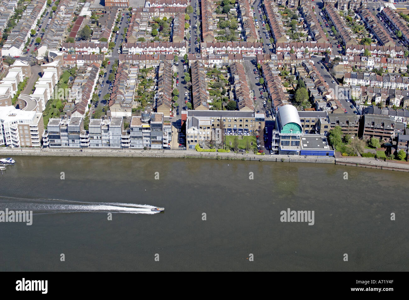 Aerial high level oblique view east of suburbs and houses of ...