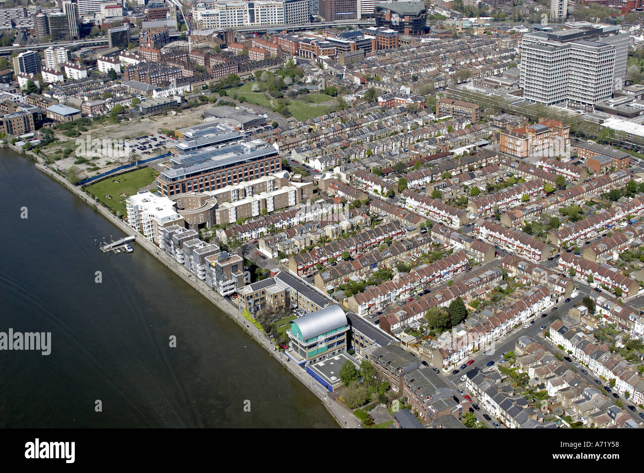 Aerial high level oblique view north east of suburbs and houses of ...