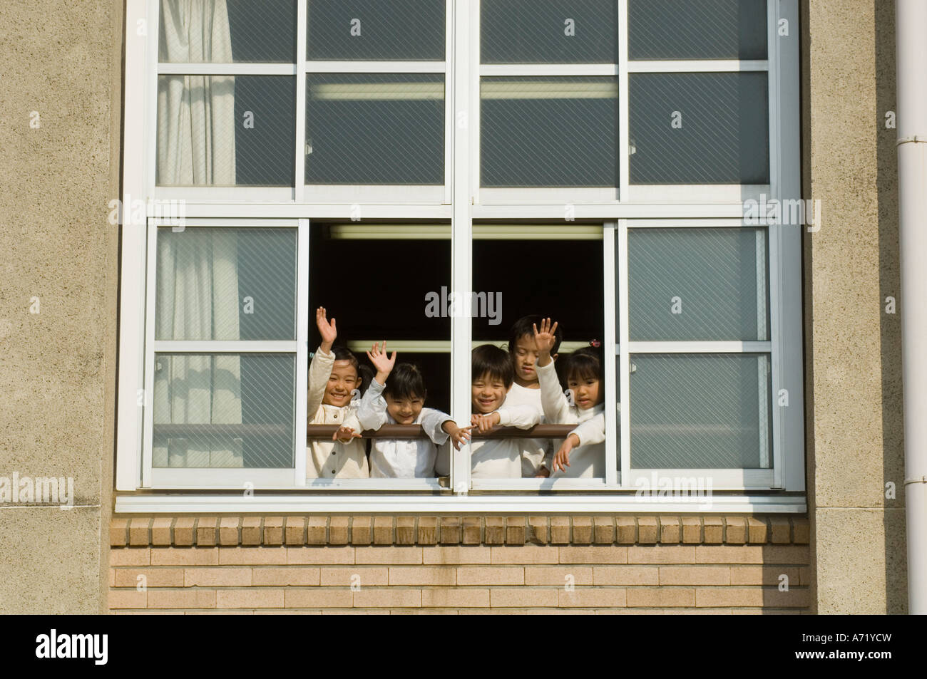 Children looking out of window at school Stock Photo - Alamy
