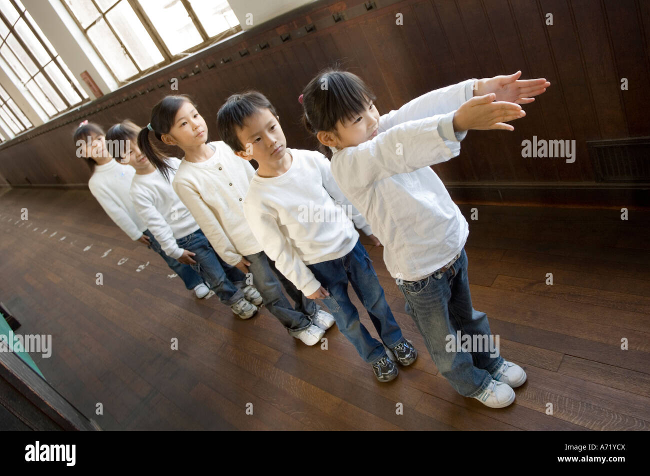 Children standing in a row Stock Photo - Alamy