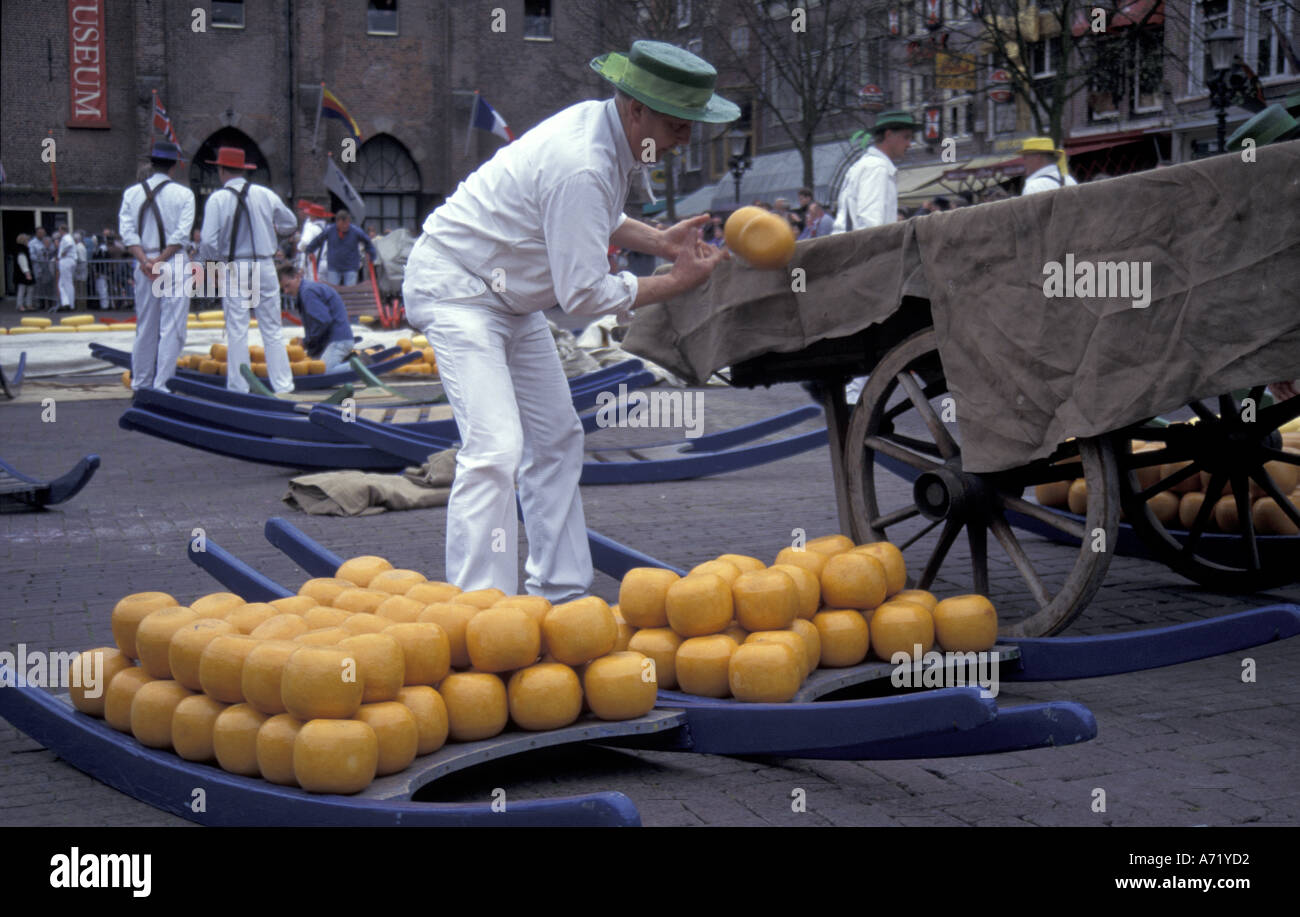 Europe, Netherlands, Alkmaar Porter loading cart at the cheese market ...