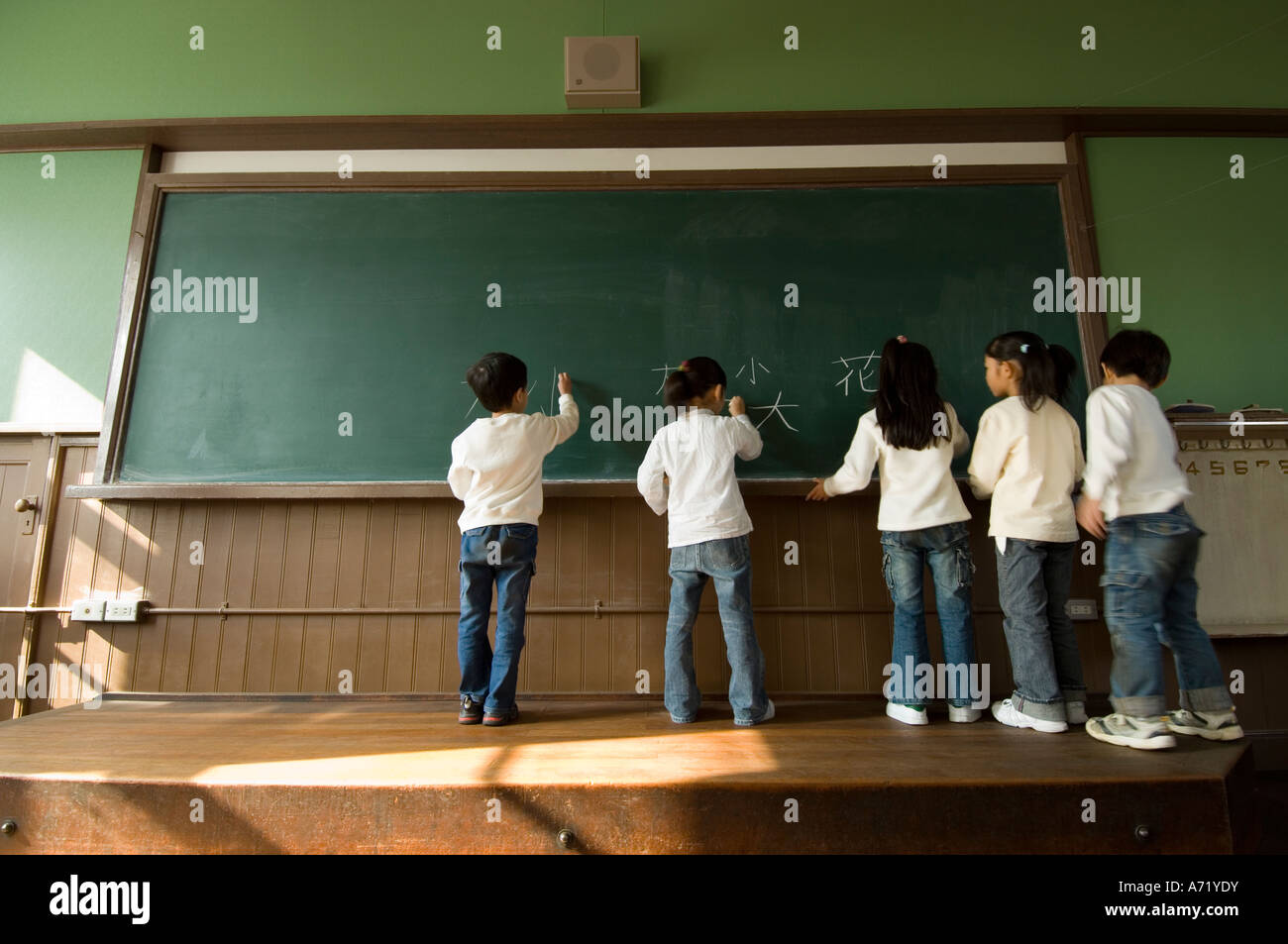 Children Writing On Blackboard High Resolution Stock Photography and ...