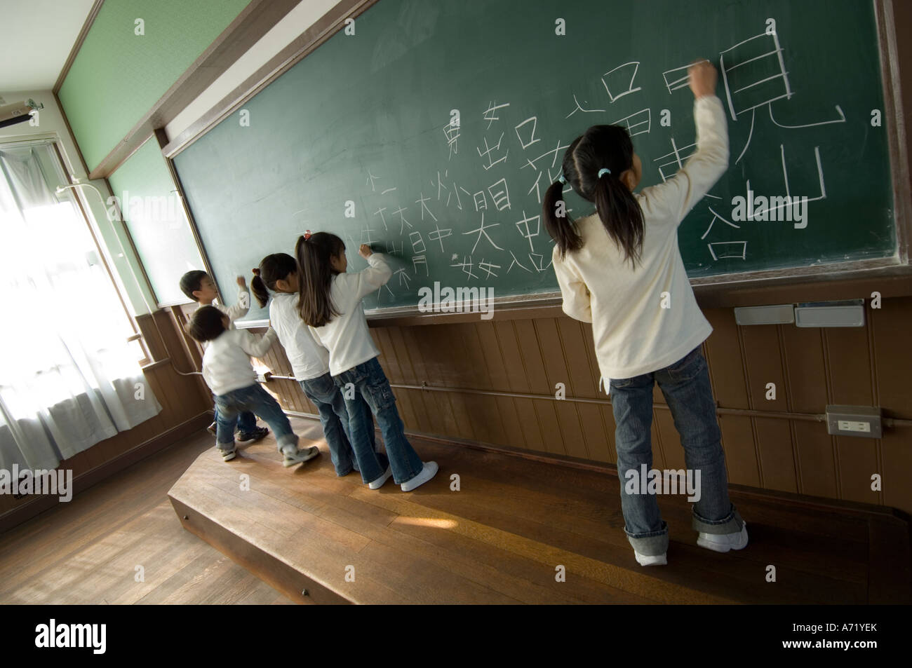 Children Writing On Blackboard High Resolution Stock Photography and ...