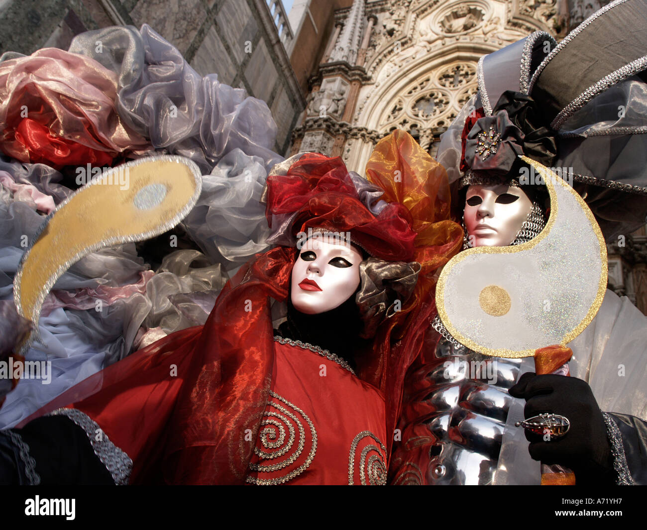 3 revellers at Venice carnival wearing costumes Stock Photo - Alamy