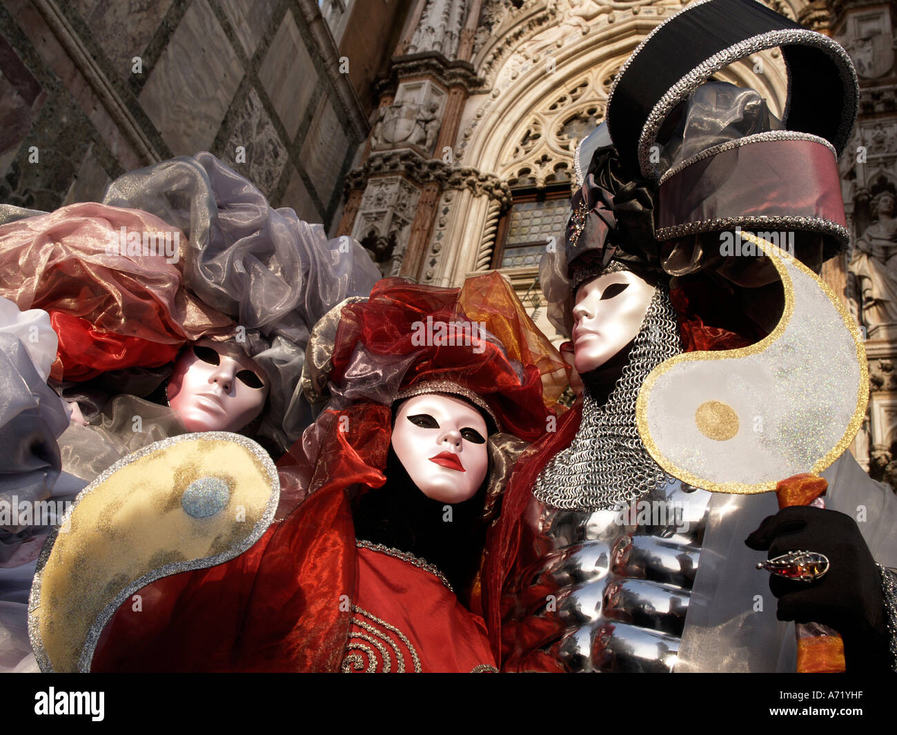 3 revellers at Venice carnival wearing costumes Stock Photo - Alamy