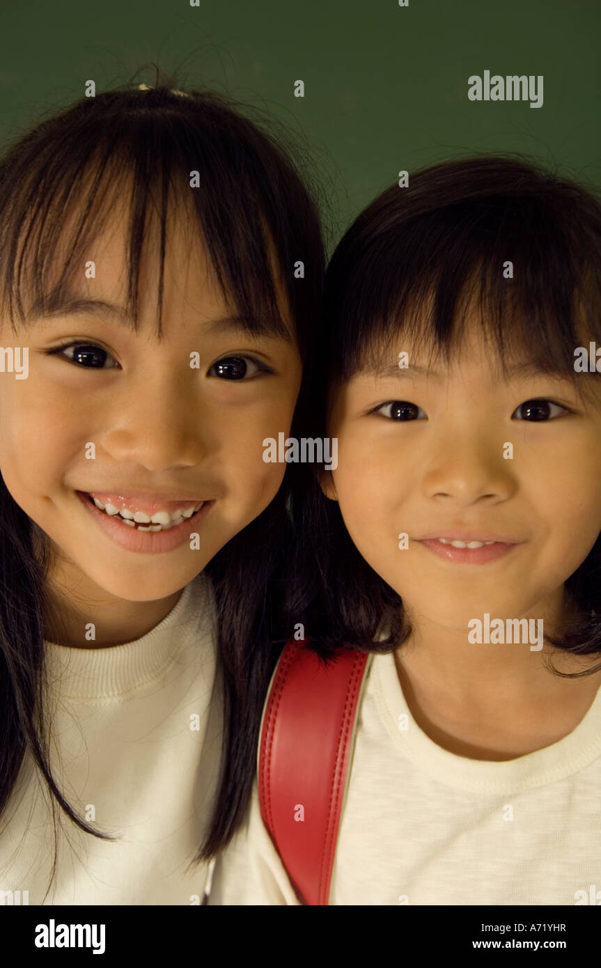Two girls smiling Stock Photo - Alamy