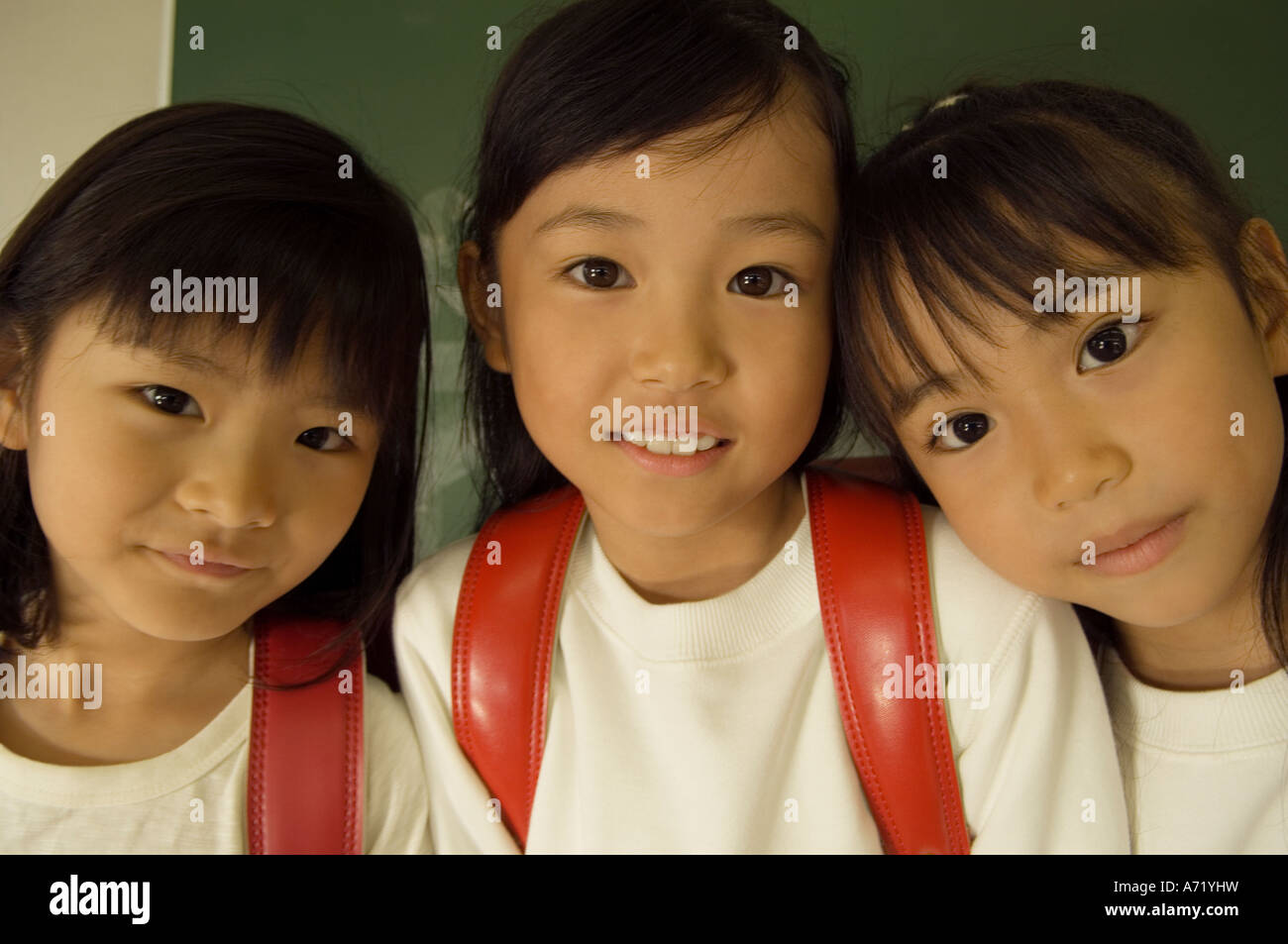 Three girls smiling Stock Photo - Alamy