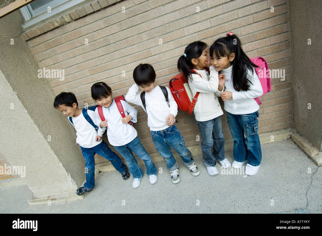 Children standing in a row Stock Photo - Alamy