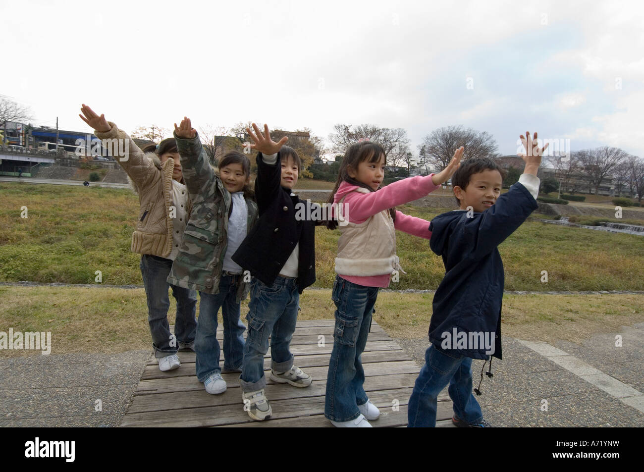 Children standing in a row Stock Photo - Alamy
