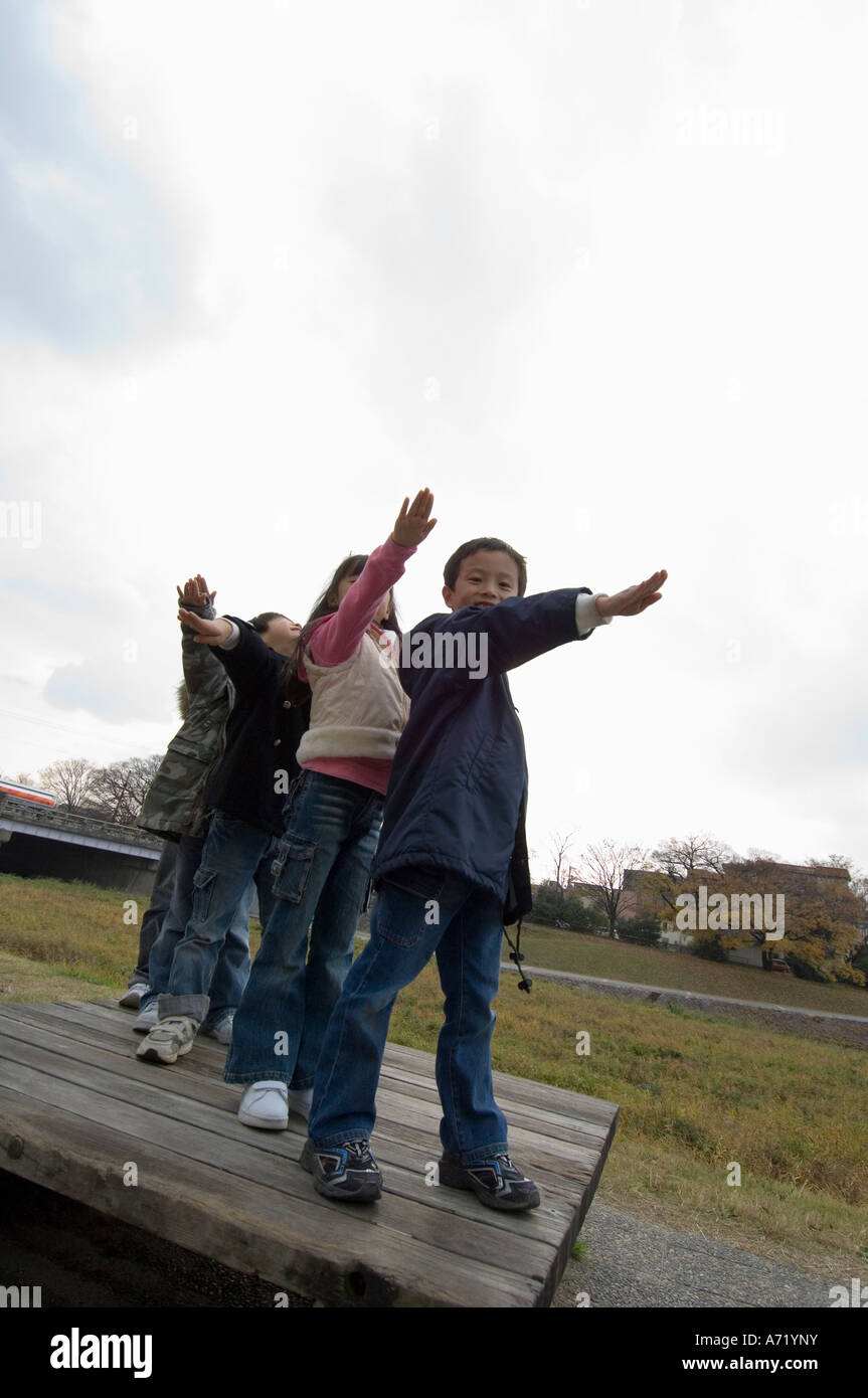 Children standing in a row Stock Photo - Alamy