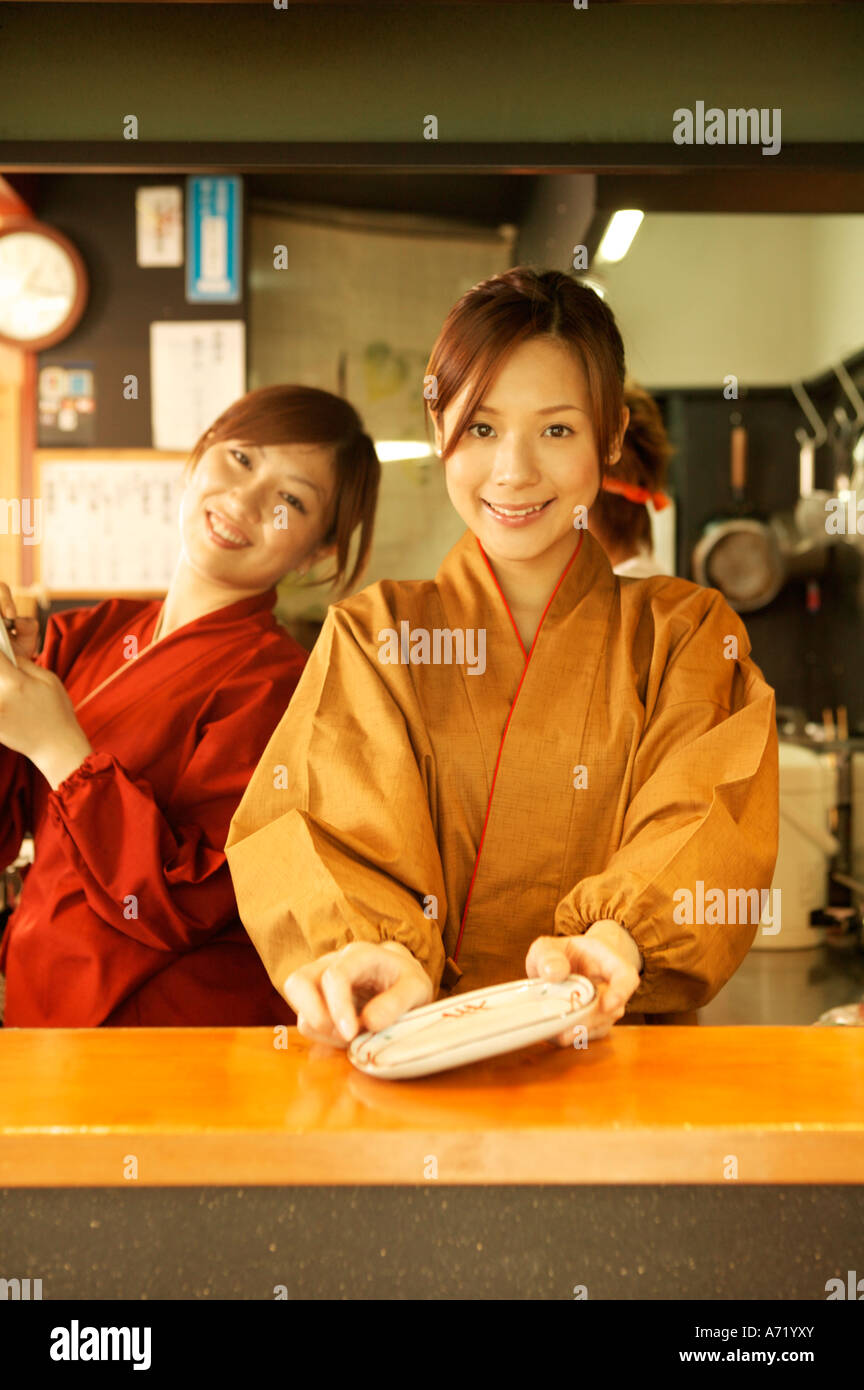 Young women working in restaurant kitchen Stock Photo - Alamy