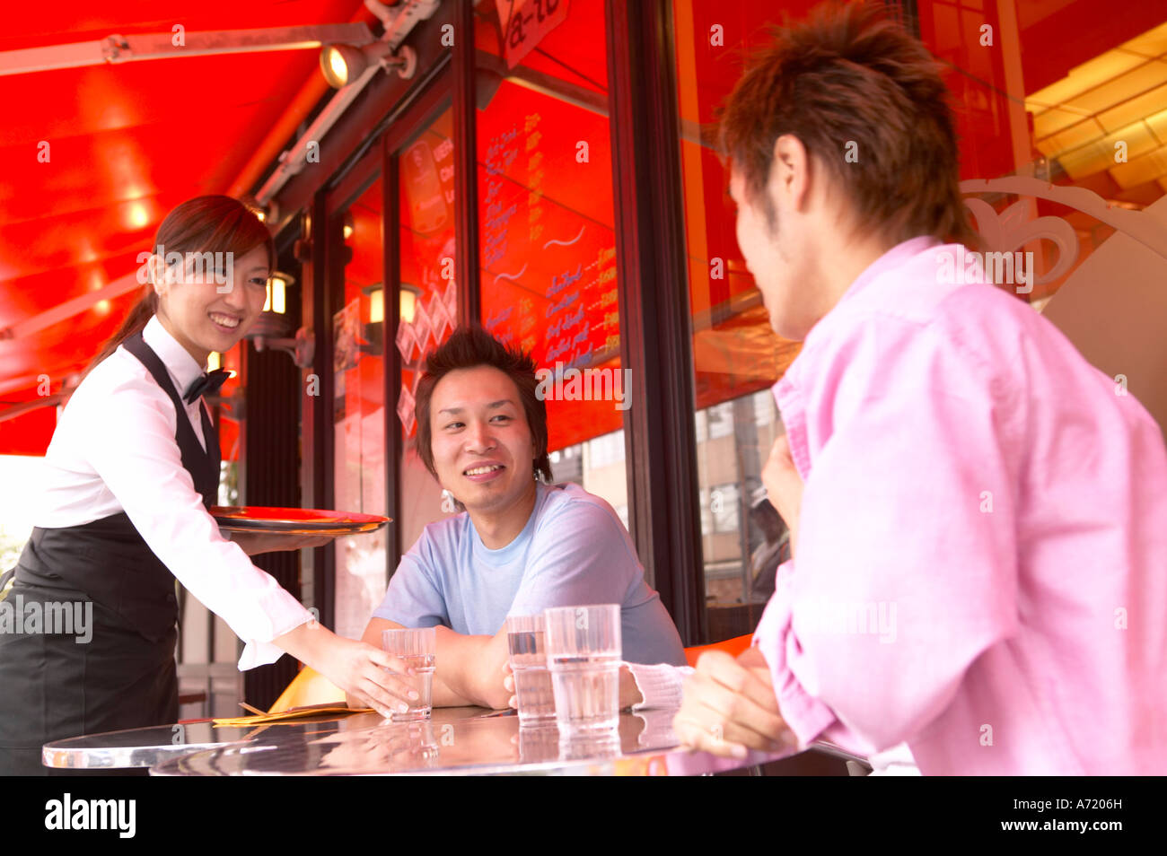 Waitress serving water Stock Photo - Alamy
