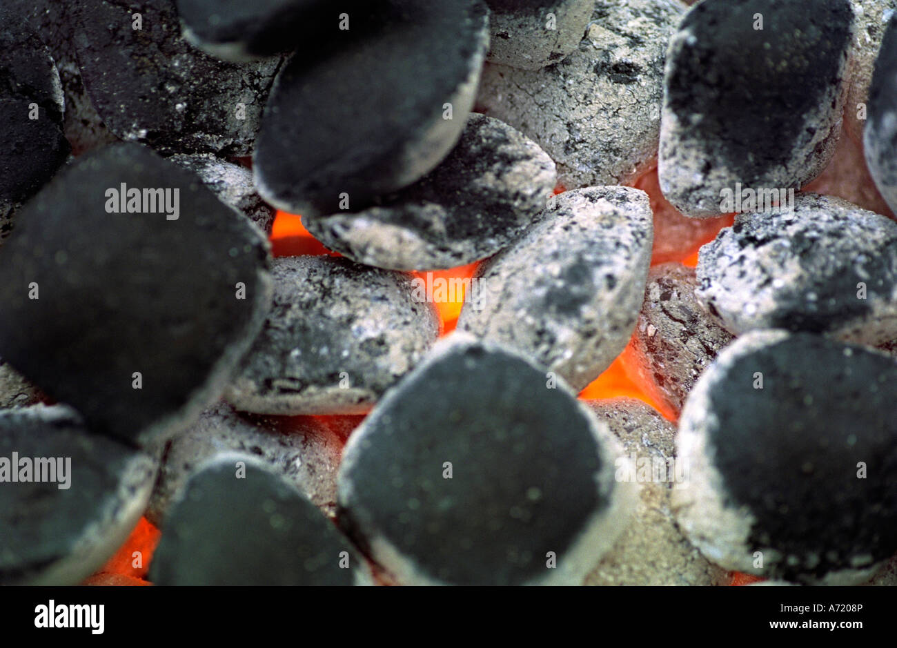 A group of hot lit charcoal on a barbecue ready for using to grill a ...