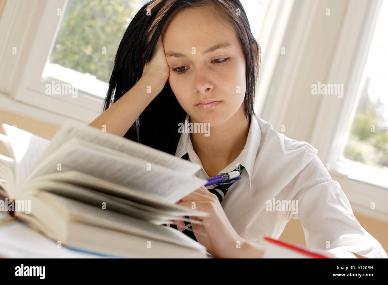 School girl doing homework Stock Photo - Alamy