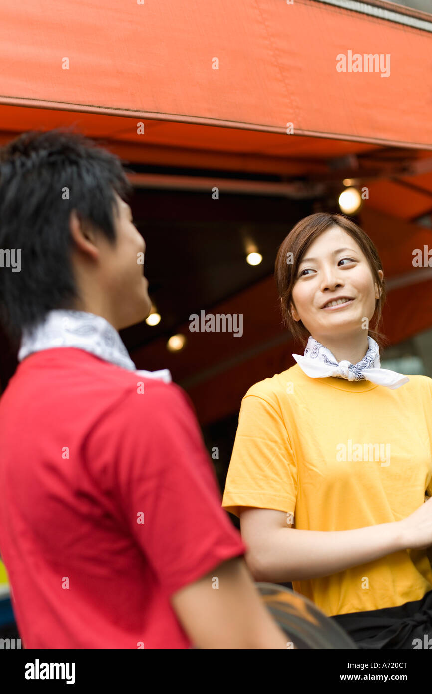 Waiters standing in front of coffee shop Stock Photo - Alamy