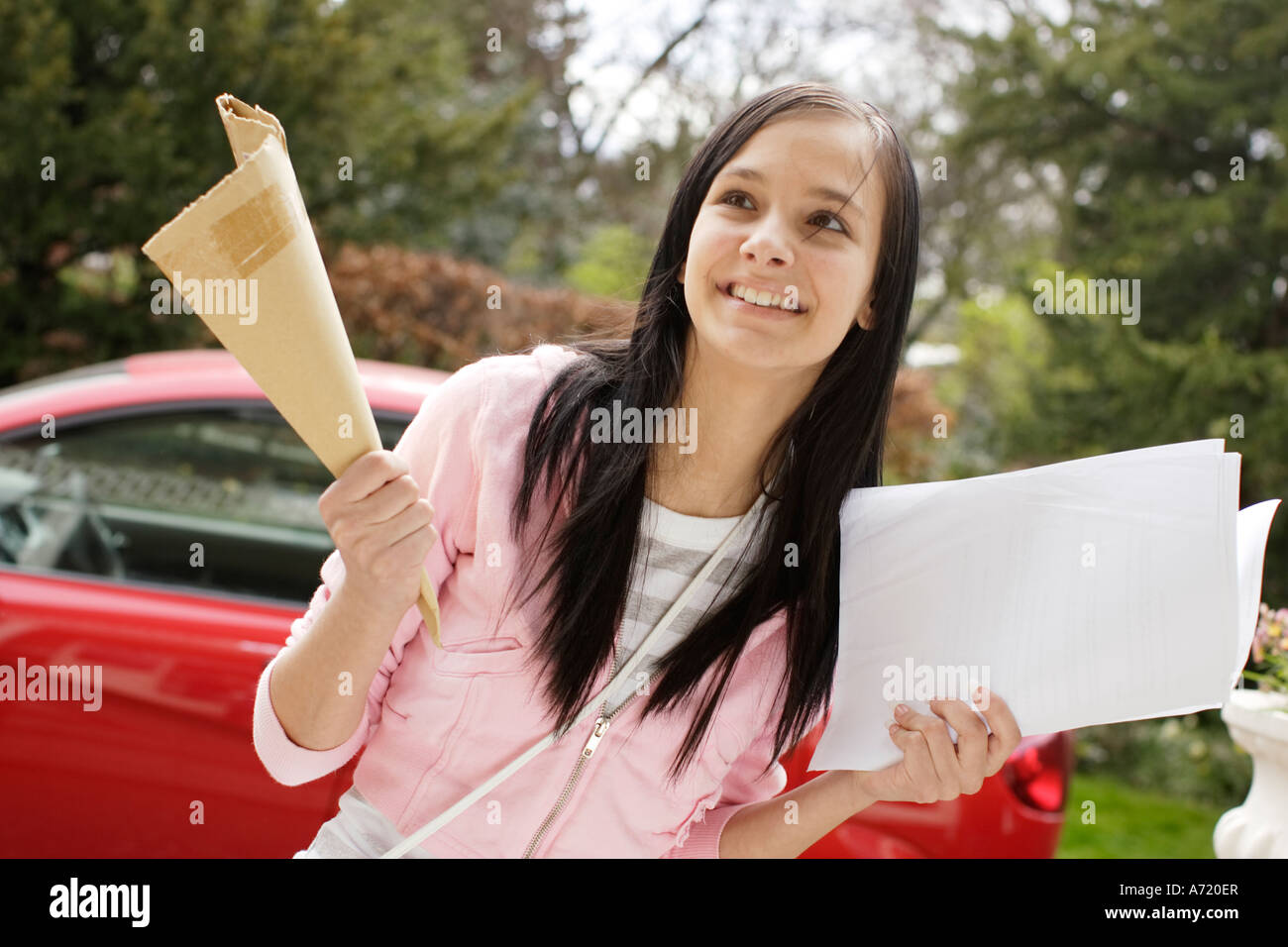 Girl pleased at receiving results Stock Photo - Alamy