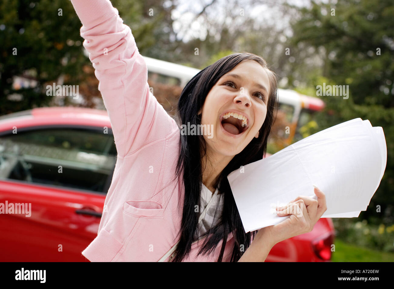 Girl pleased at receiving results Stock Photo - Alamy