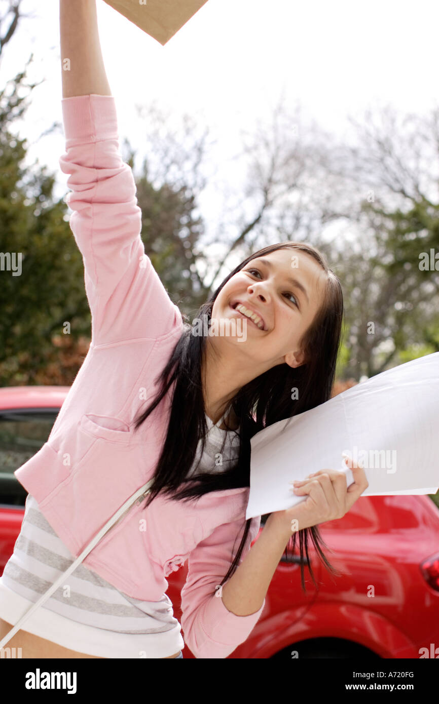 Girl pleased at receiving results Stock Photo - Alamy