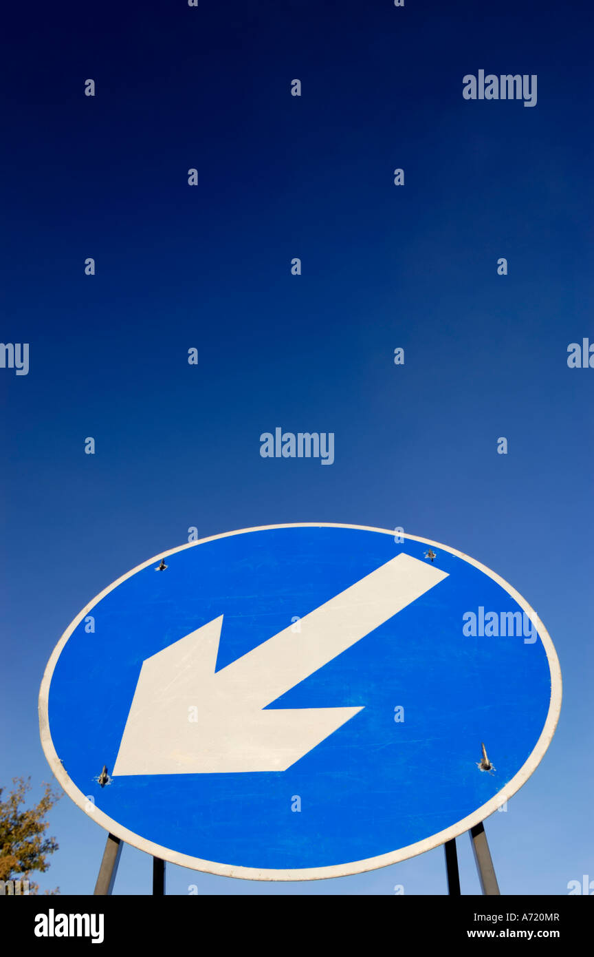 a pointed arrow to direct traffic at road works in england Stock Photo ...
