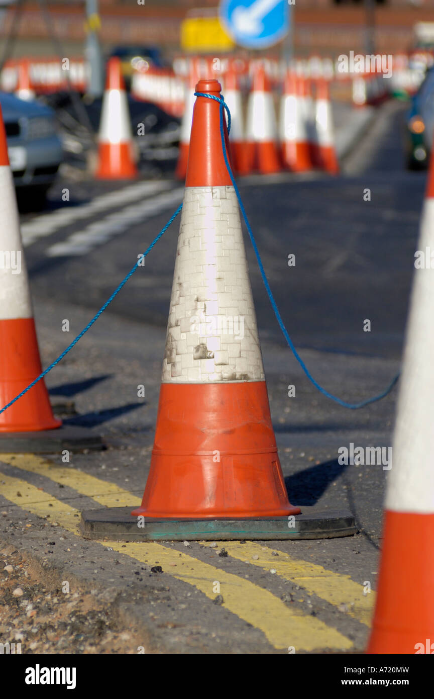 traffic cones to guide traffic past some road building Stock Photo - Alamy