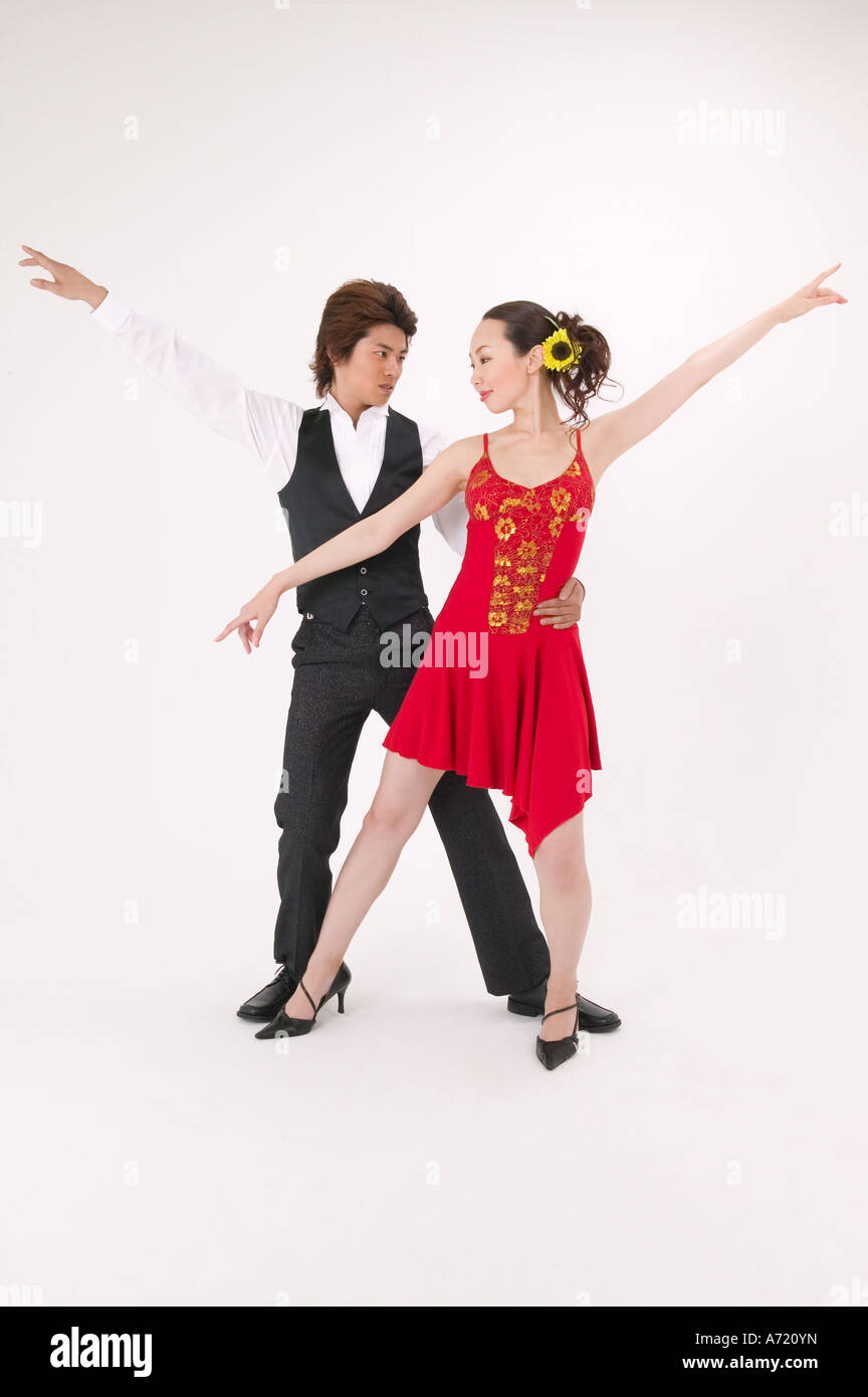 Young couple dancing salsa Stock Photo - Alamy