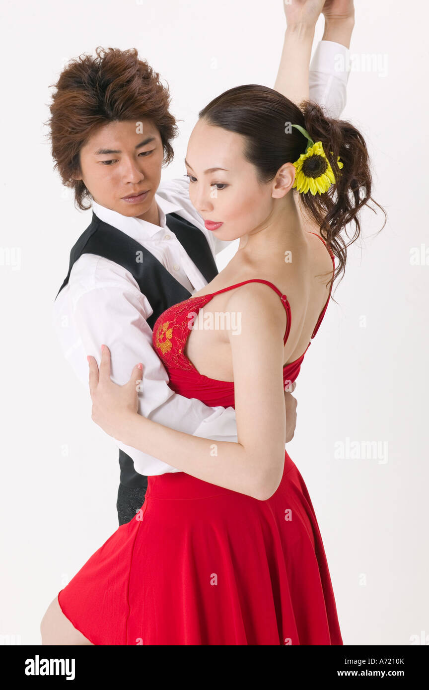 Young couple dancing salsa Stock Photo - Alamy