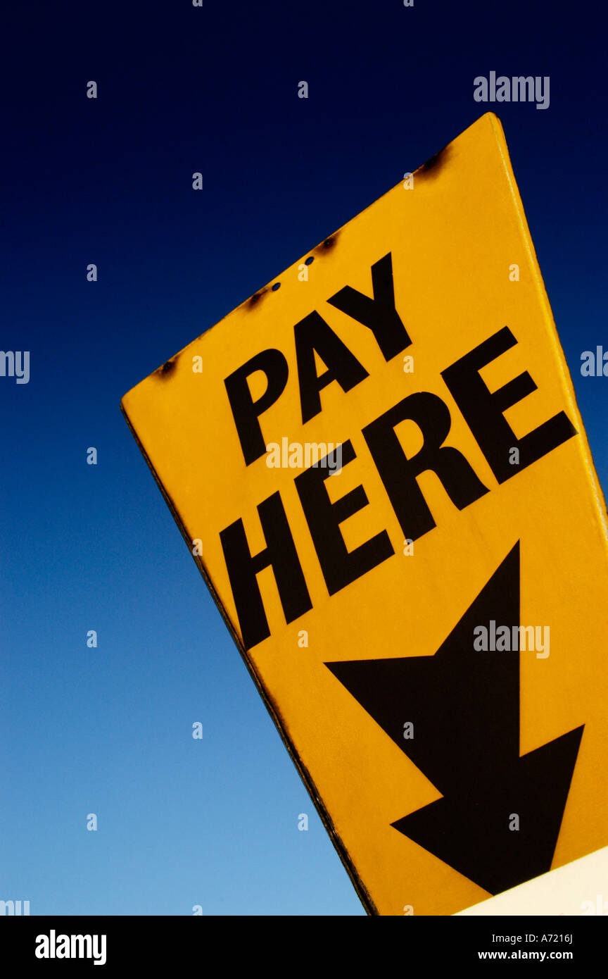 a pay machine in a carpark in a the uk saying pay here Stock Photo - Alamy