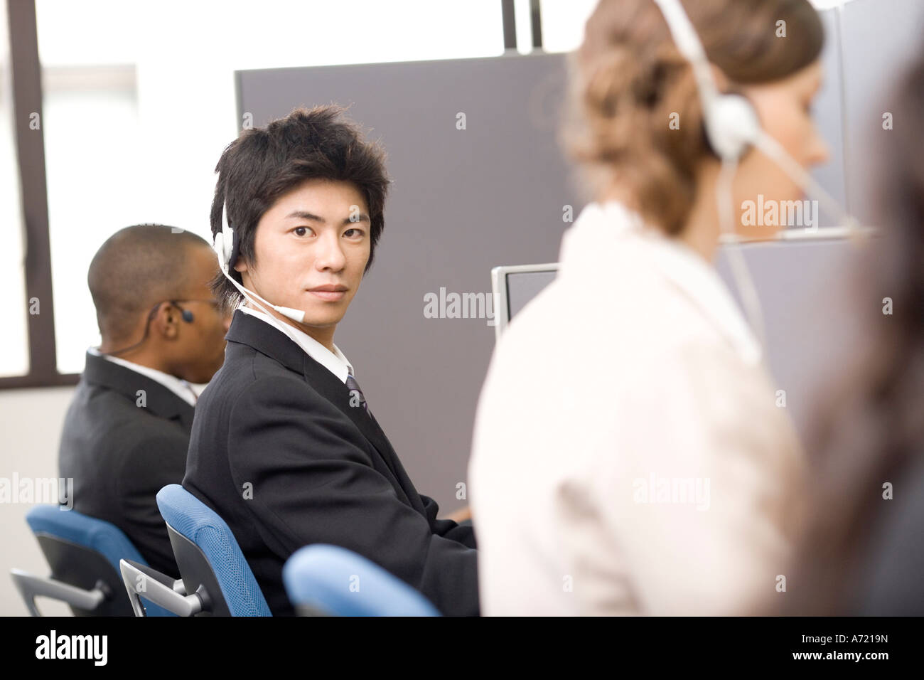 Young man working in call center Stock Photo - Alamy