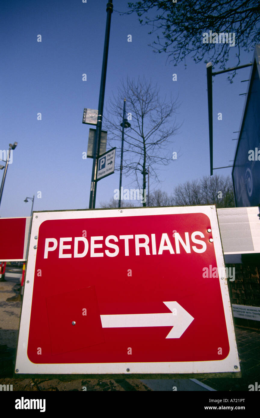 a pedestrians this way sign to let people know which way to walk around ...