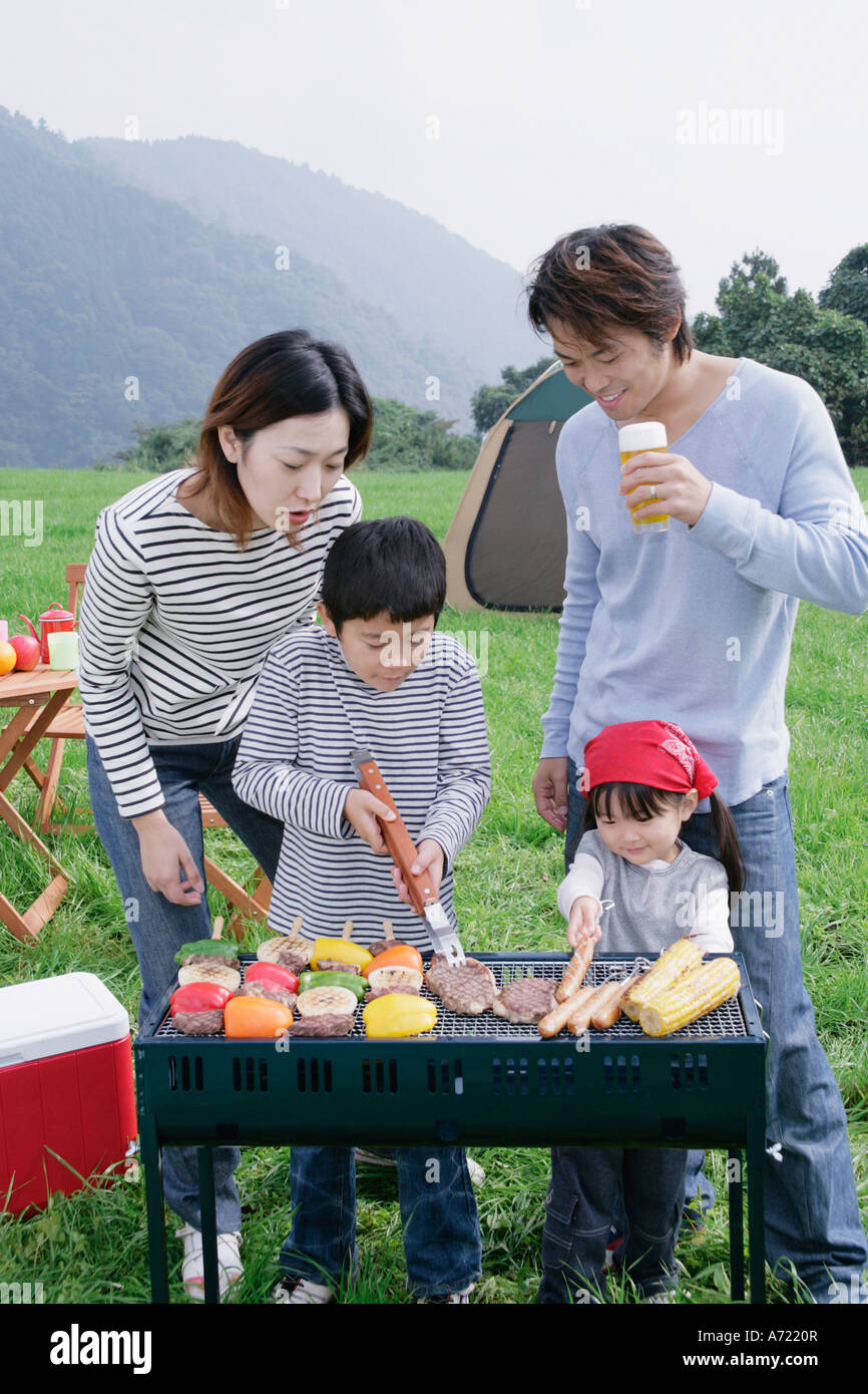 Family having barbeque Stock Photo - Alamy