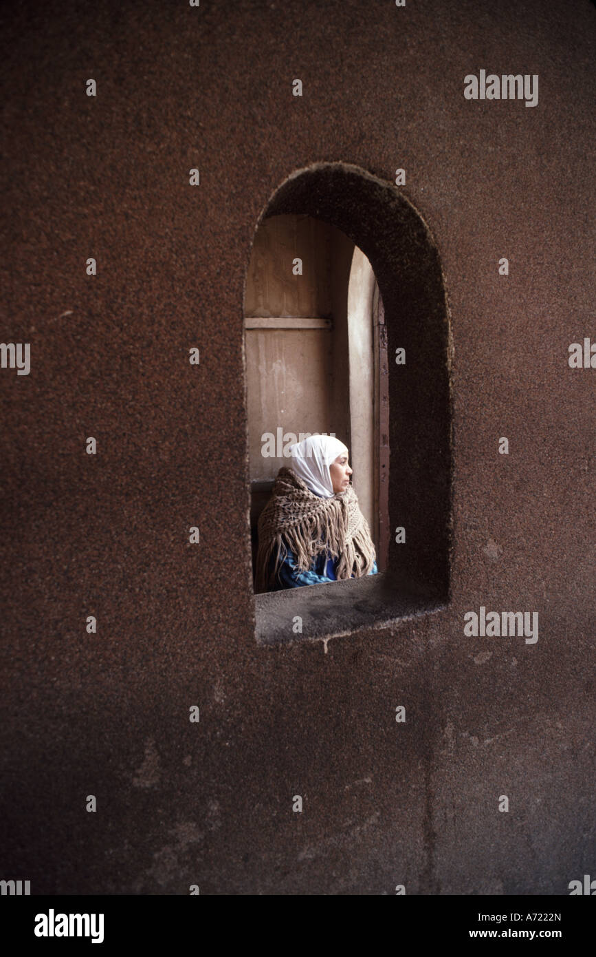 A portrait of an Egyptian woman seen throughan open window Stock Photo ...