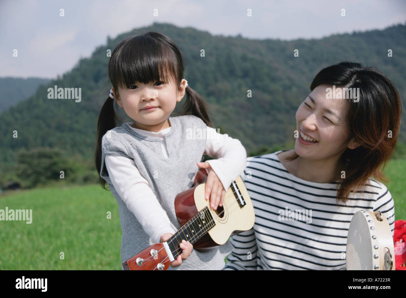 Mother and daughter with musical instruments Stock Photo - Alamy