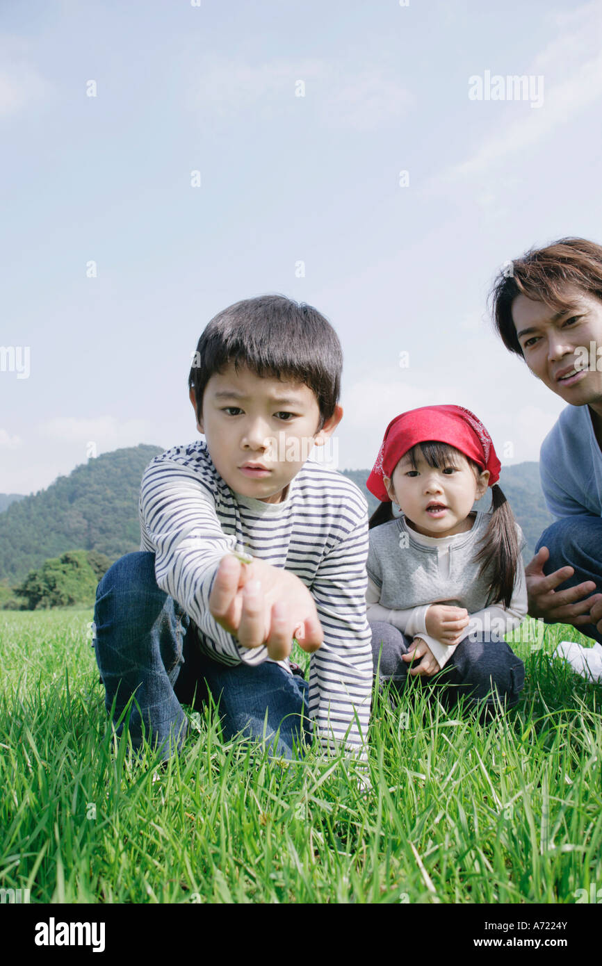 Family catching insects in hi-res stock photography and images - Alamy