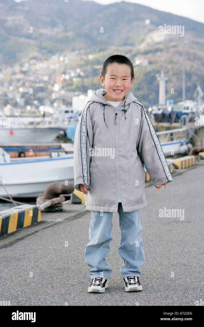 Portrait of a boy standing Stock Photo - Alamy