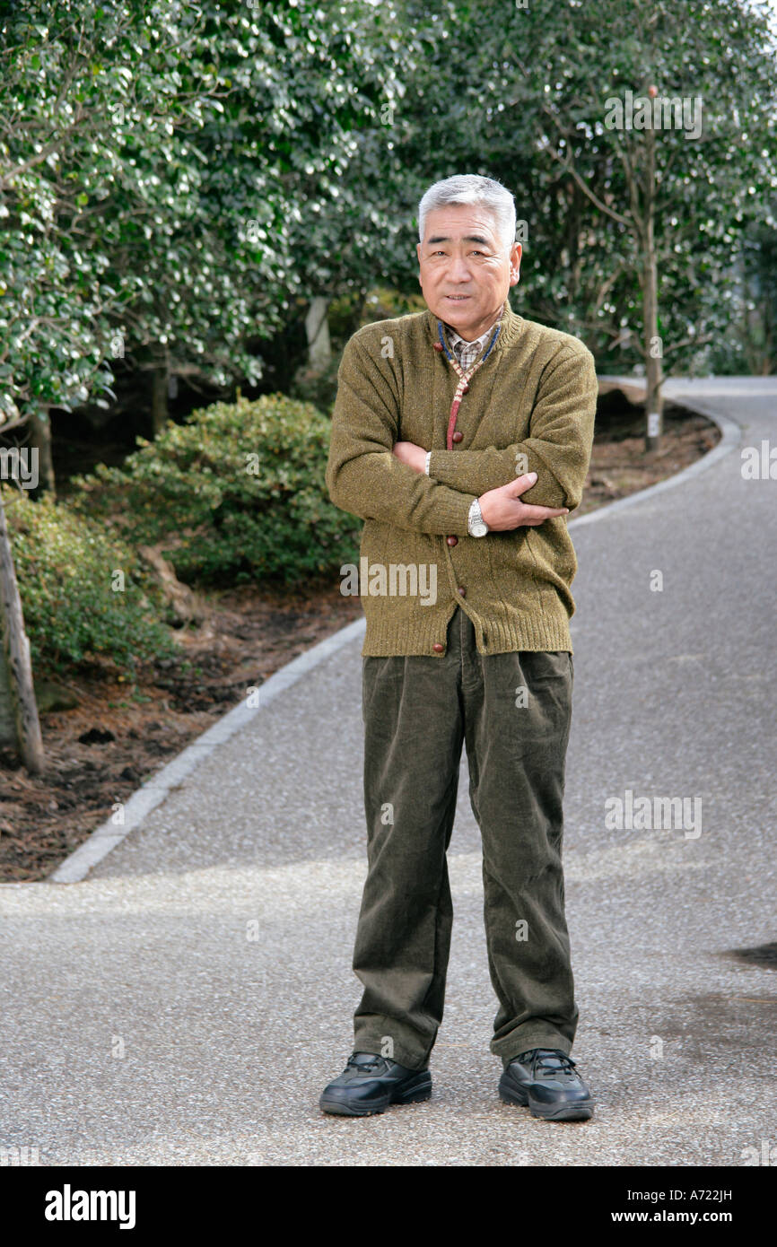 Portrait of a senior man standing Stock Photo - Alamy