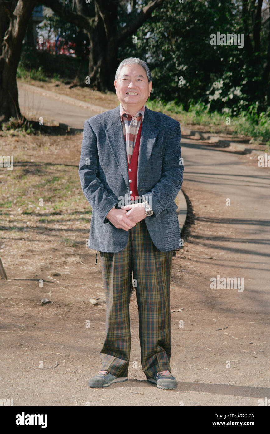 Portrait of a senior man standing Stock Photo - Alamy