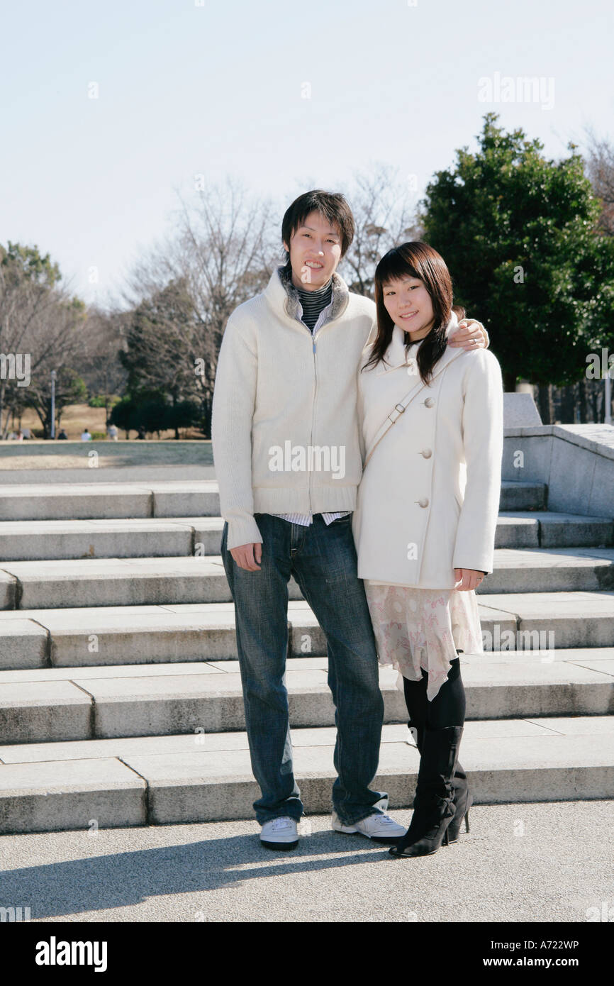 Portrait of young couple standing Stock Photo - Alamy