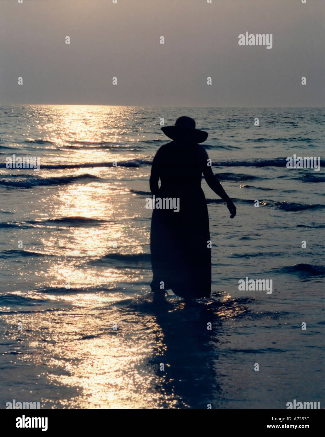 Woman in dress wading in water hi-res stock photography and images - Alamy