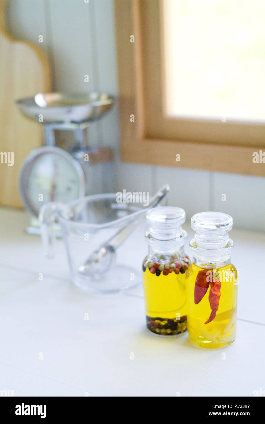 Kitchen utensils and bottles of olive oil with spices Stock Photo - Alamy