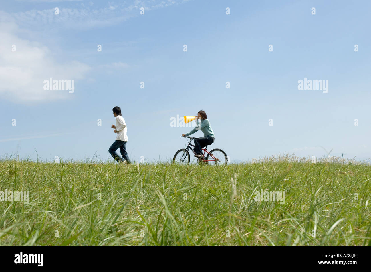 Young asian couple running riding hi-res stock photography and images ...